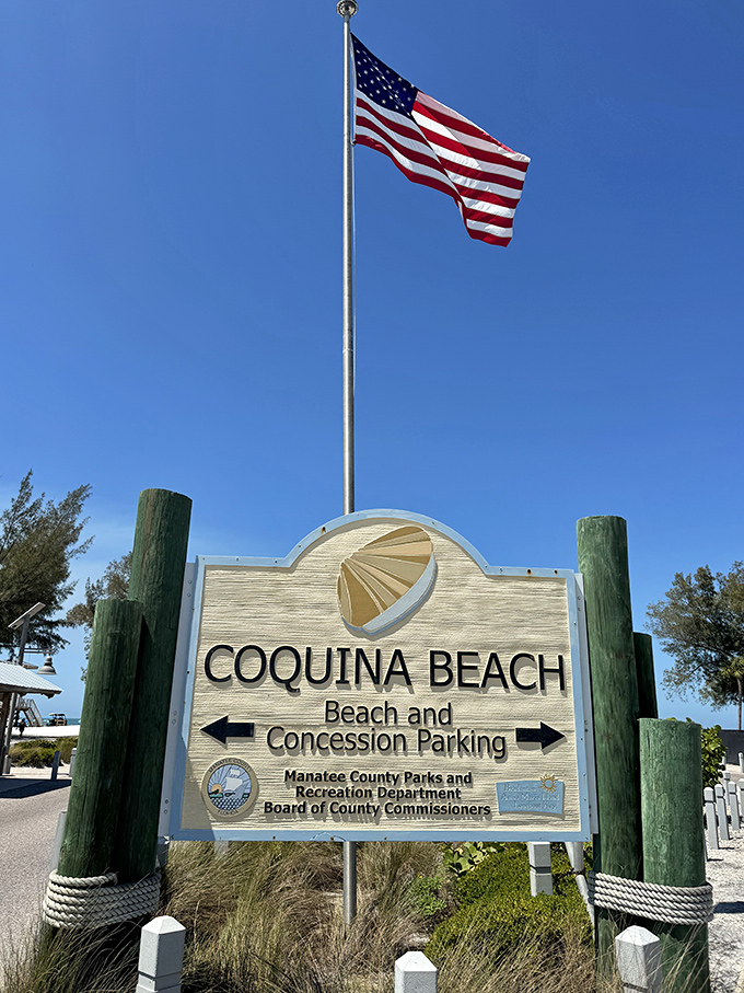 The gateway to sandy bliss. This sign doesn't just mark an entrance—it's the official boundary between your regular life and your vacation self.