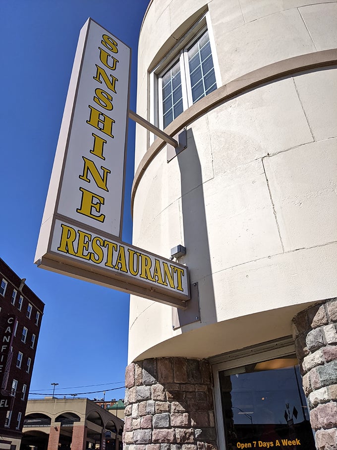 The vertical promise of "SUNSHINE" against a blue Iowa sky—a siren call to hungry travelers that good things await inside.