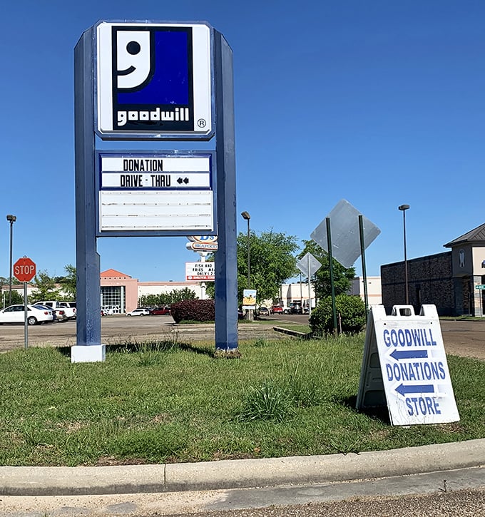The roadside sign stands as a North Star for bargain hunters—pointing the way to thrifting nirvana.