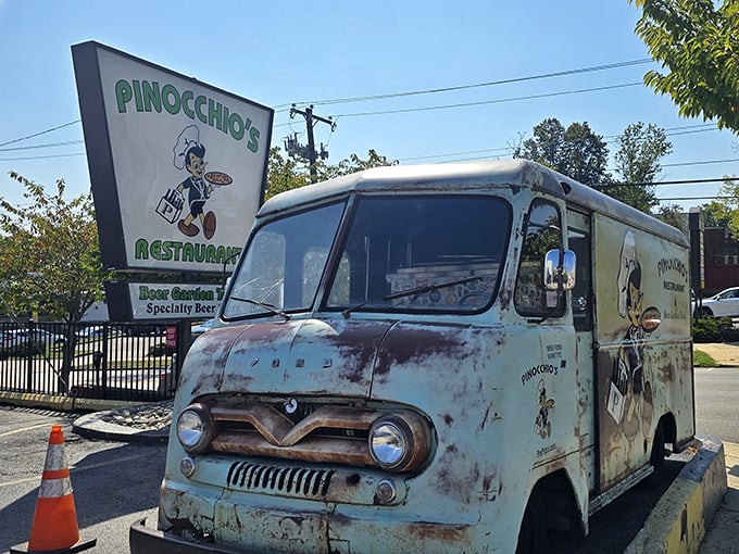 That vintage delivery truck hasn't moved in years, but it's earned its retirement after delivering countless pizzas to hungry homes.
