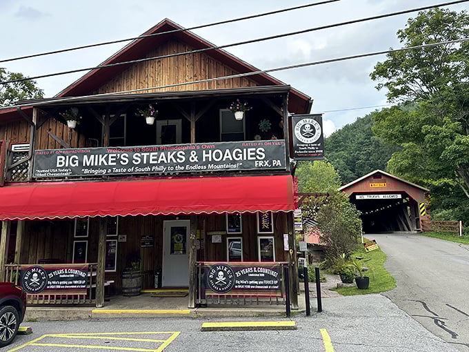 The wooden exterior with its iconic red awning sits perfectly against the backdrop of Pennsylvania's rolling hills – a sandwich shop that belongs exactly where it is.
