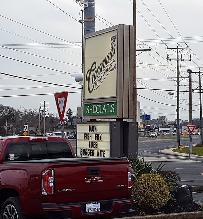 The roadside sign announces daily specials like a town crier of deliciousness. Tuesday's Burger Nite has clearly built a loyal following.
