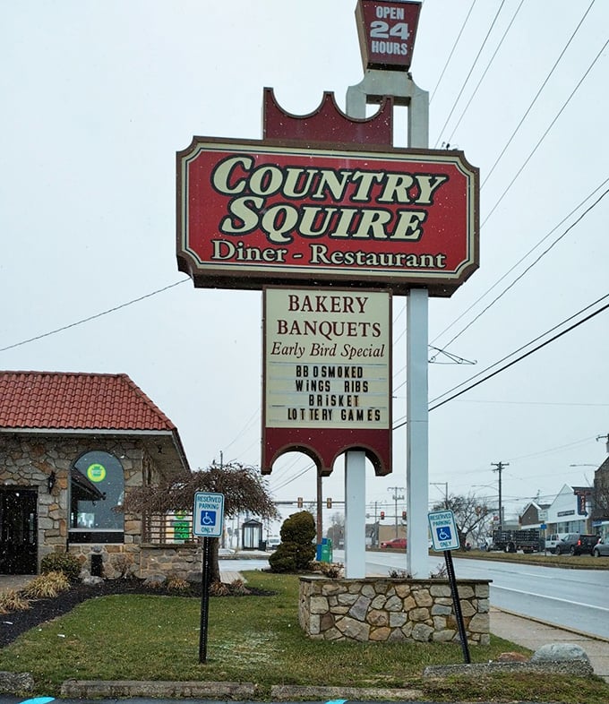 The 24-hour sign promises breakfast salvation at any hour – a comforting constant in an ever-changing world.