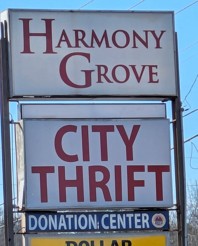 The beacon that guides bargain hunters to paradise. City Thrift's sign promises adventures in secondhand shopping that never disappoint.