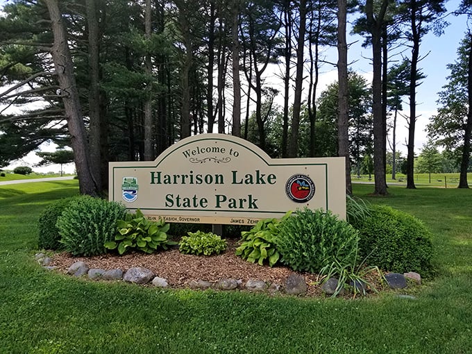 The entrance sign stands as both welcome and gentle reminder that you're entering a place where nature, not humans, sets the rules.