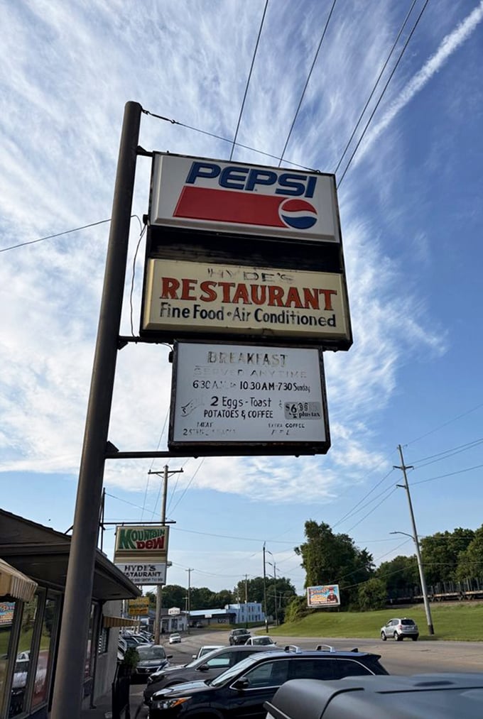 That classic roadside sign against an Ohio sky—a beacon for hungry travelers and a landmark for locals who measure their lives by meals shared here.