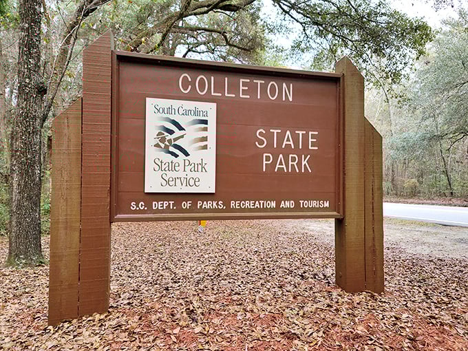 The entrance sign promises adventures beyond. Like all good journeys, this one begins with a wooden sign and ends with memories.