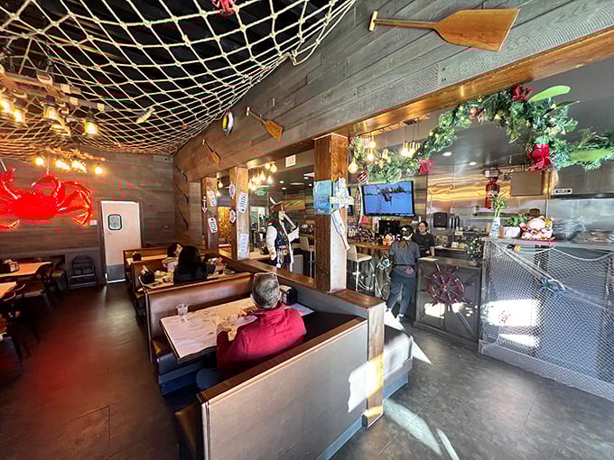 Fishing nets overhead and wooden accents throughout create an atmosphere that's both cozy and reminiscent of a dockside eatery.