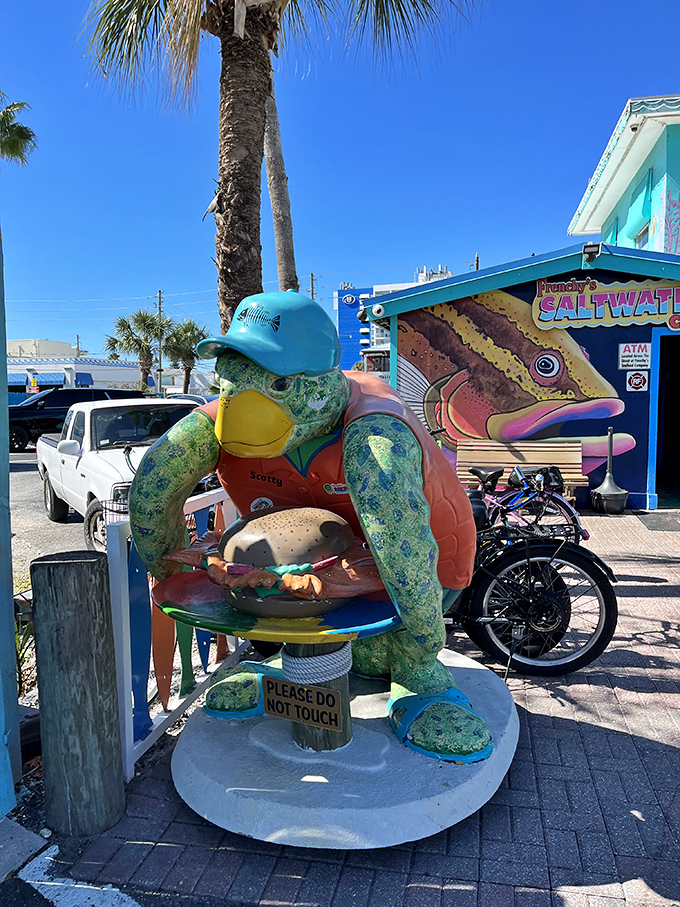 This whimsical sea turtle statue stands guard outside, a quirky ambassador welcoming you to seafood paradise with a burger already in hand.