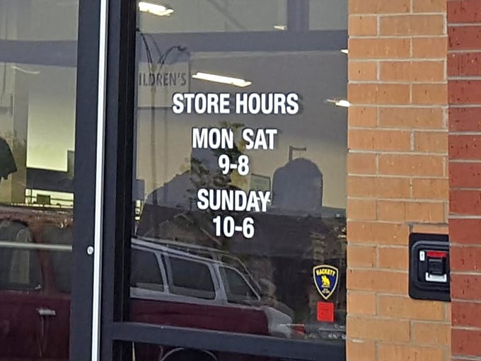 The store hours sign promises ample opportunity for treasure hunting—because bargains wait for no one, not even on Sundays.
