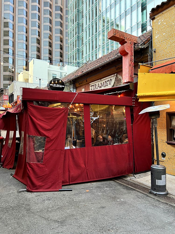 Even bundled up for San Francisco weather, Café Tiramisu's exterior radiates Mediterranean warmth. That burgundy awning is a beacon for hungry souls.