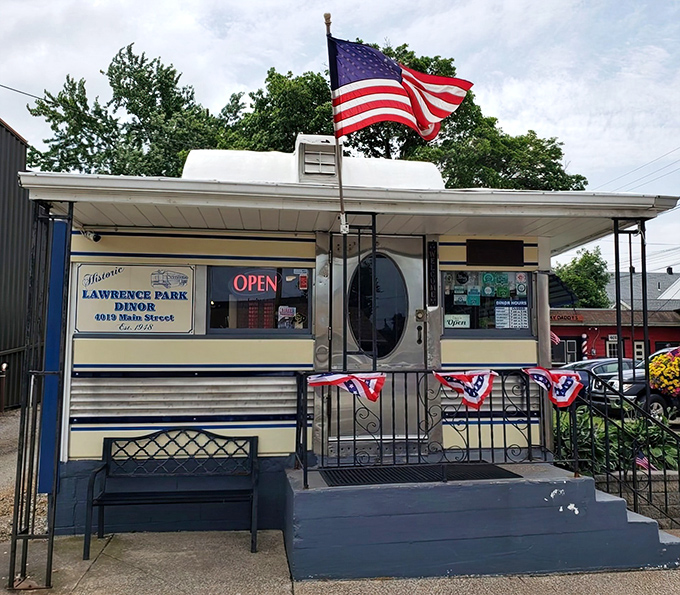 The historic storefront proudly displays its heritage—"Lawrence Park Dinor" with American flags adding a touch of hometown pride.
