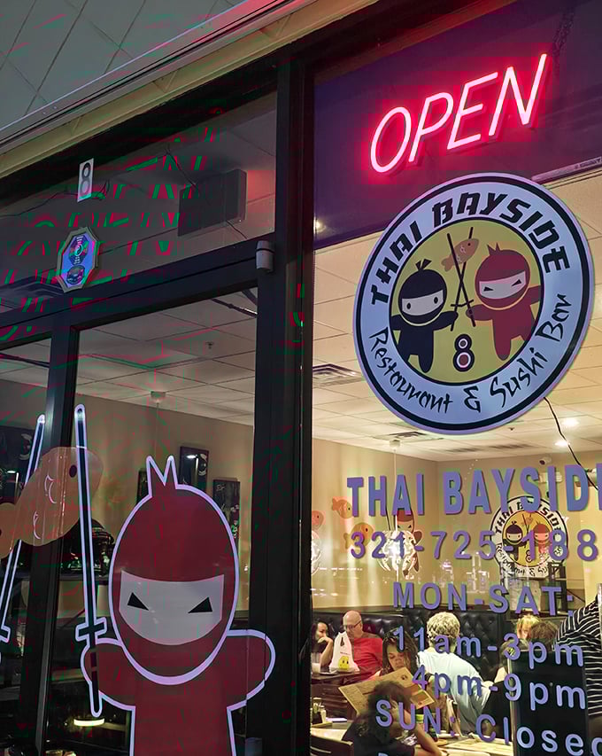 The glowing "OPEN" sign and ninja mascots—your signal that authentic Thai flavors await just beyond these doors.