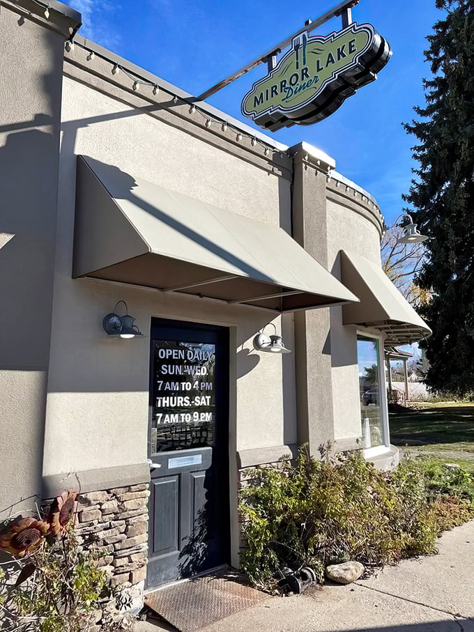 The sign promises "OPEN DAILY"—three syllables that sound like music when you're hungry and the mountains have worked up your appetite.