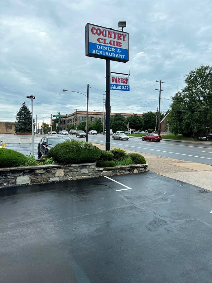 The roadside sign stands as a beacon of hope for hungry travelers and locals alike—promising salvation in the form of pancakes.
