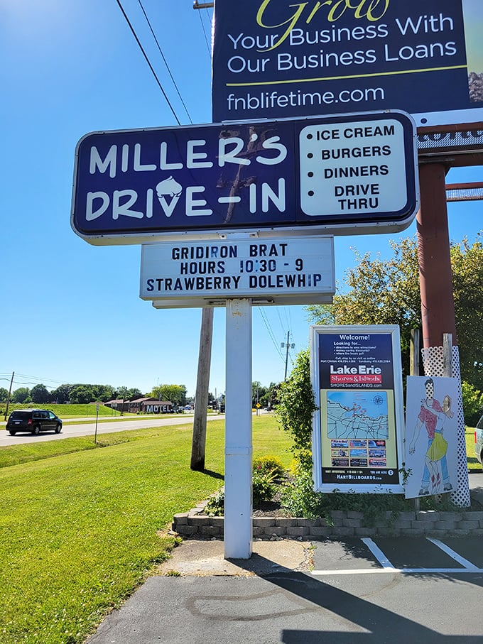 The roadside sign stands as both landmark and promise—burgers, ice cream, and a temporary escape from the modern world await just ahead.