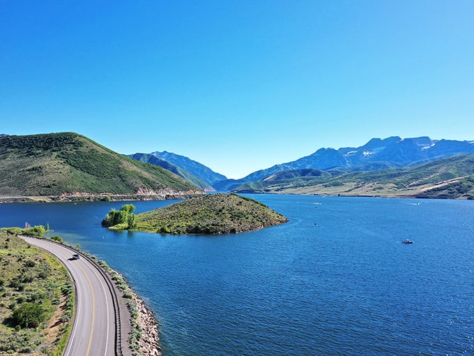 Bird's eye perfection—where blue waters embrace a tiny island, creating a scene so idyllic it belongs on Utah's tourism brochures.