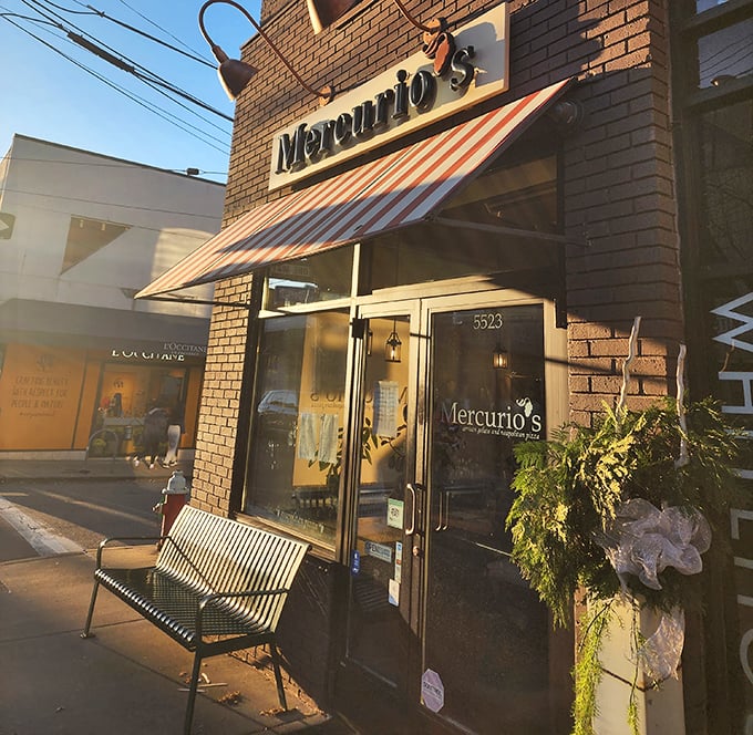 Golden hour at Mercurio's – when the evening light hits that striped awning just right, and you know pizza perfection awaits inside.