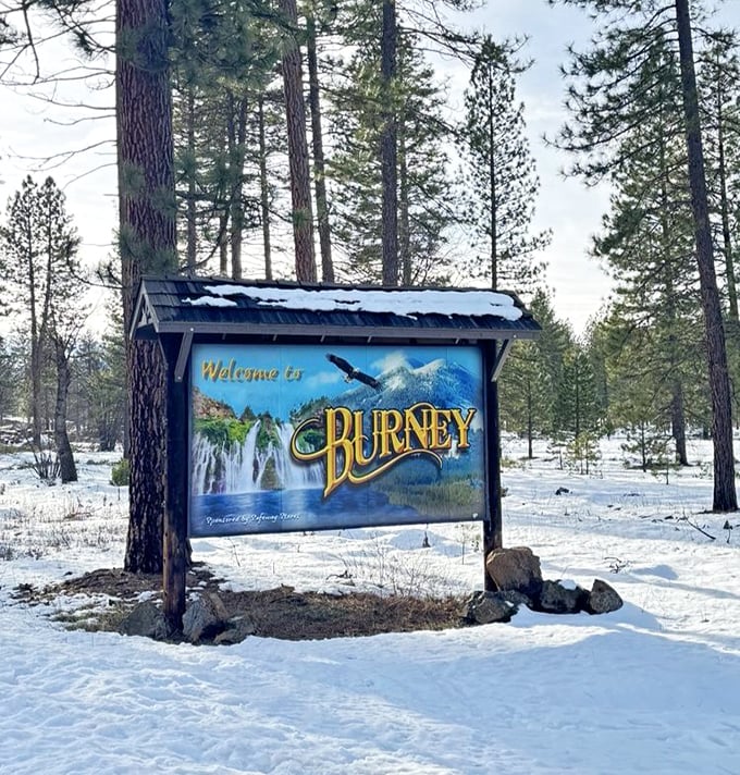 Winter transforms Burney into a snow globe scene. Even in the coldest months, the welcome sign promises the falls continue their eternal performance.