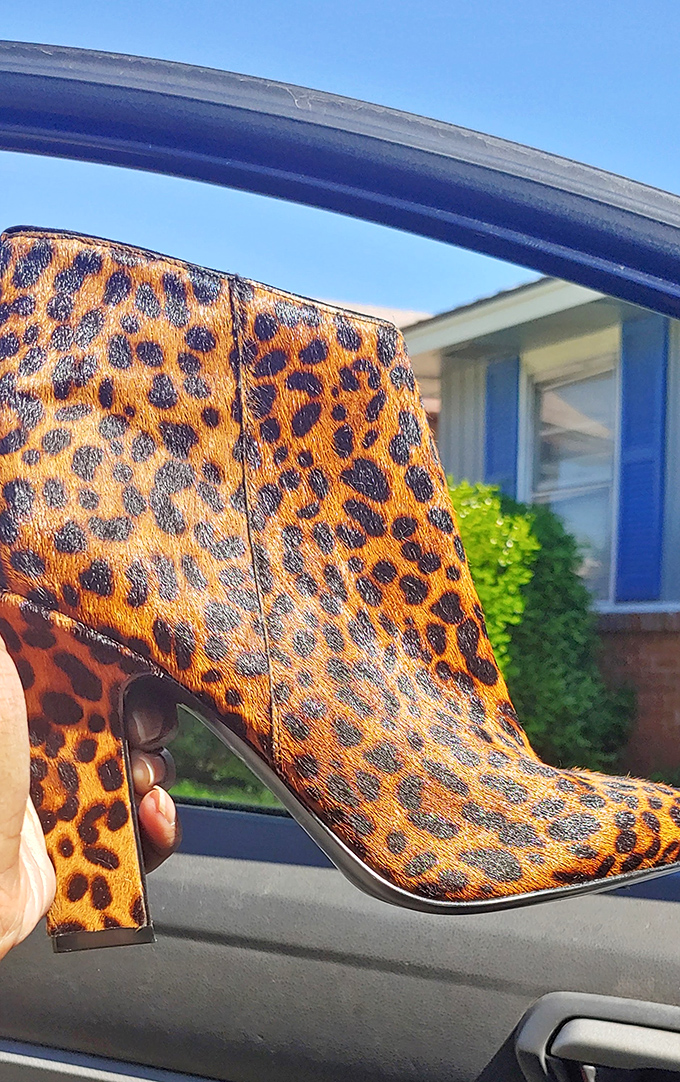 Leopard print booties that scream "confidence" without shouting "I paid full price"—the ultimate secondhand shopping victory.