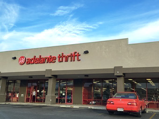 The bright red Adelante Thrift sign beckons like a beacon of bargain-hunting hope. Treasure awaits inside!