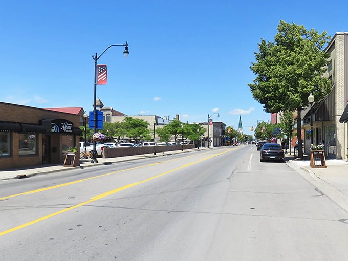 Alpena's main street stretches toward the horizon like a Norman Rockwell painting come to life, complete with American flags and small-town charm.