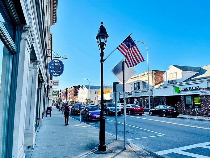 Athol's Main Street welcomes you with classic New England charm – lamp posts, flags, and small-town bustle that feels like coming home.