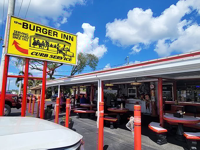 The bright yellow Burger Inn sign stands like a time machine to the 1950s. Curb service still lives at this Melbourne classic!