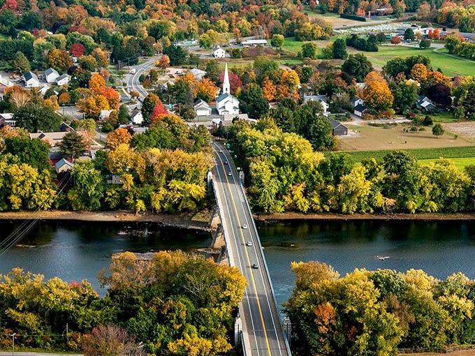 An aerial autumn view reveals Deerfield's timeless New England charm, where history lives on every tree-lined street below.
