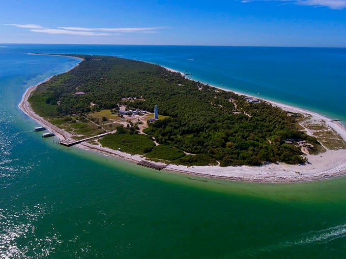 Egmont Key from above – nature's perfect horseshoe of paradise, where dolphins play and history sleeps beneath the palms.