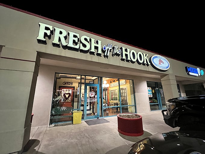 Fresh Off The Hook's illuminated storefront beckons seafood lovers like a lighthouse calling ships home after dark.