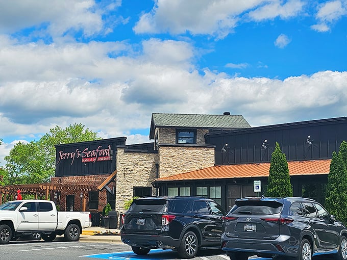 Jerry's Seafood exterior beckons with its stone-and-brick charm. The "Home of the Crab Bomb" isn't just a tagline—it's a delicious promise.