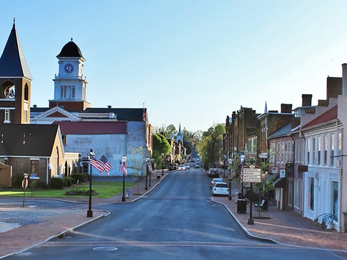 Historic Jonesborough's Main Street whispers stories from centuries past, where the clock tower keeps watch over brick-lined sidewalks and American flags flutter proudly.