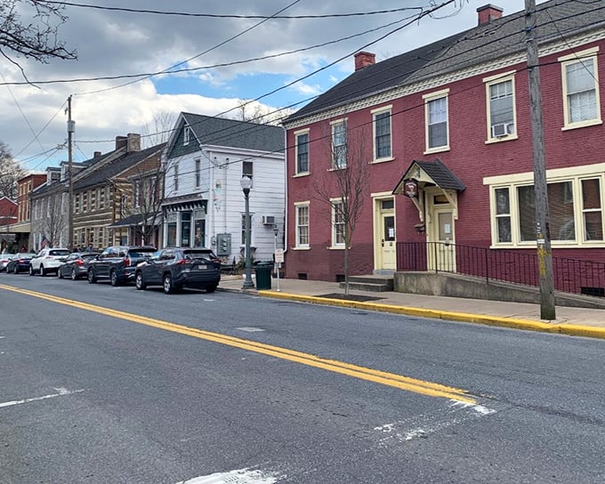 Picture this: red brick buildings lined up like old friends sharing secrets on a perfectly peaceful street.