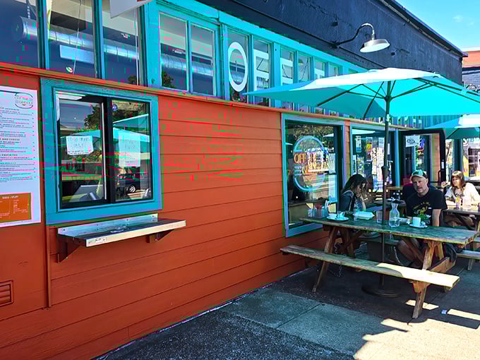 That orange and turquoise combo hits you like a Portland sunrise - bold, bright, and impossible to ignore.
