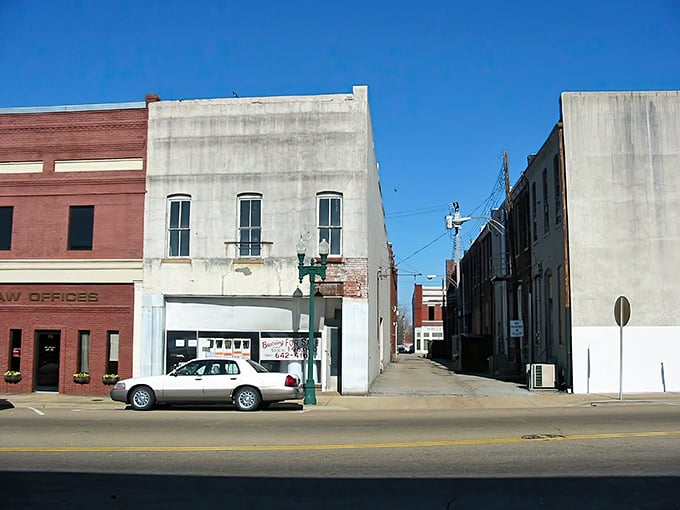 Downtown Paris showcases classic small-town charm with historic brick buildings lining Main Street under a perfect blue Tennessee sky.