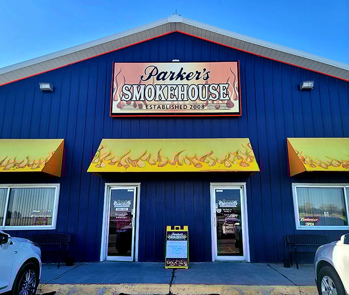 That bright blue building with flame awnings isn't hiding - it's announcing serious barbecue business ahead.