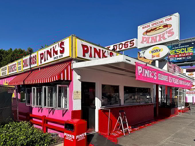 Pink's iconic pink and red facade beckons like a neon love letter to hot dog devotees everywhere.