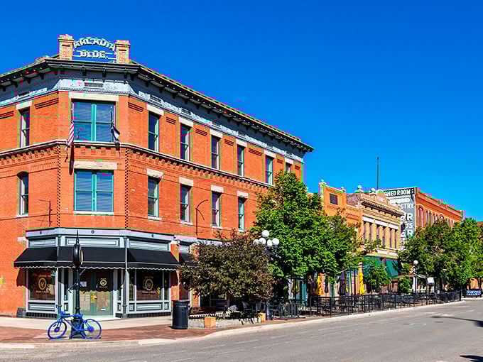 Historic red brick buildings line these charming streets where every dollar stretches like Sunday afternoon naps.