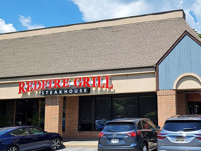 RedFire Grill's brick exterior promises what lies within—a temple to perfectly charred steaks where flavor is king.