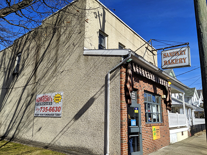 That classic brick facade whispers "real bakery ahead" - where neighborhood charm meets serious baking business.
