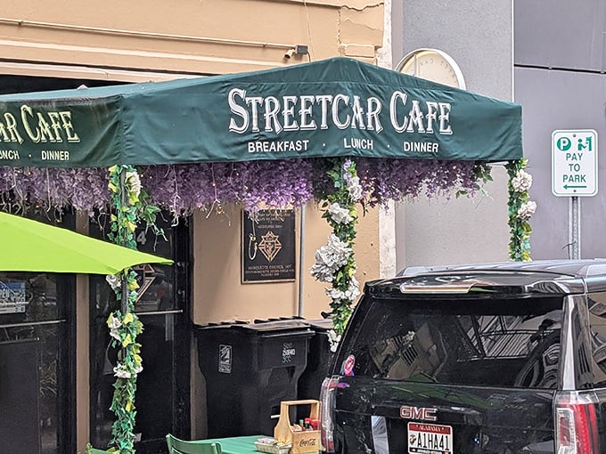 Purple paradise! Streetcar Café's wisteria-draped entrance promises breakfast magic that lives up to its flowery first impression.