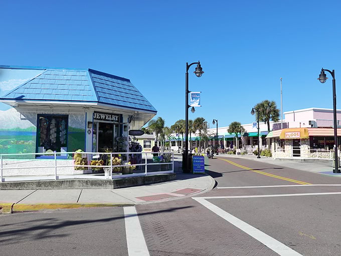 The blue-roofed jewelry shop stands like a Mediterranean sentinel, guarding the entrance to this slice of Greece in Florida.
