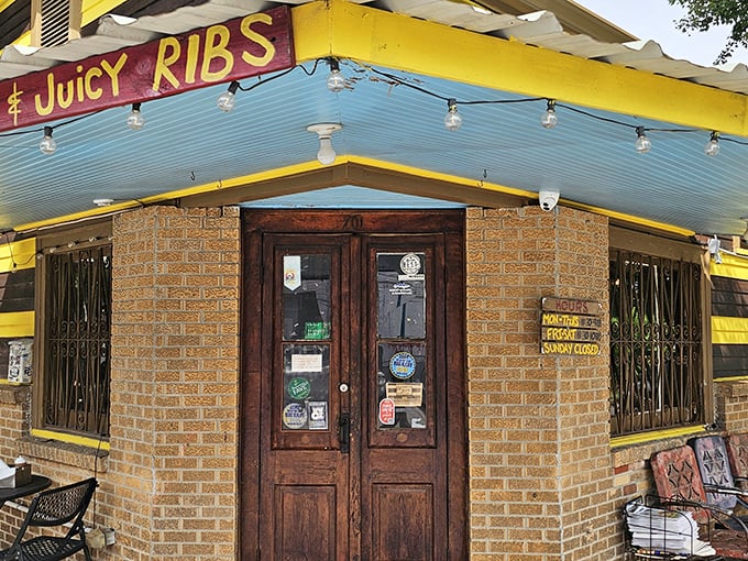 The Joint's yellow-striped exterior isn't subtle, but neither is their commitment to "Hot & Juicy Ribs" – a promise they deliver on spectacularly.