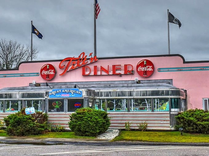 The Tilt'n Diner's pink facade and chrome trim isn't just eye-catching—it's a time machine disguised as a restaurant!