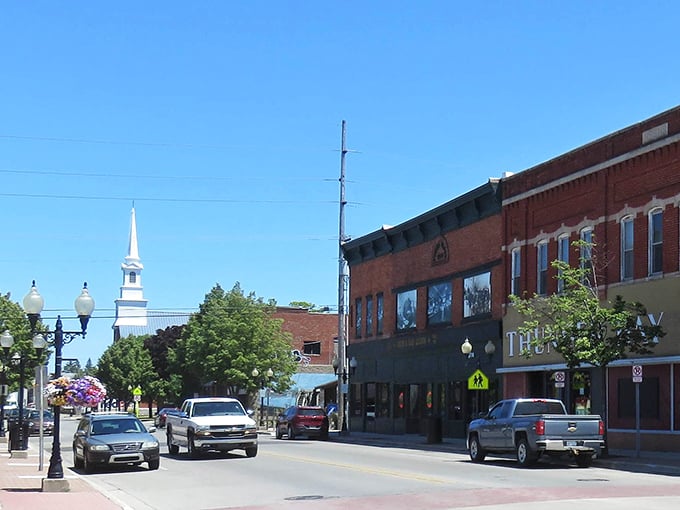 Church steeples and brick storefronts create Alpena's classic Midwestern skyline—where $150,000 still buys you a slice of lakeside paradise.