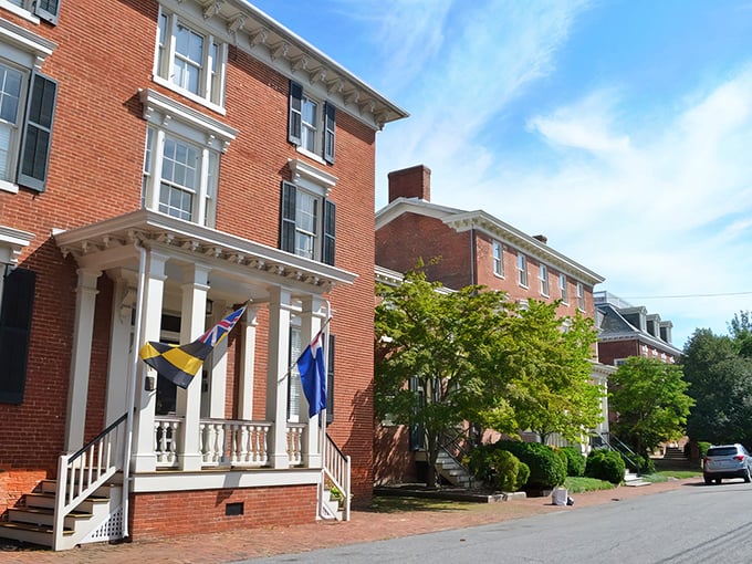 Maryland flags flutter proudly against brick facades in Chestertown, where history isn't just preserved—it's celebrated daily.