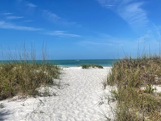 The pathway to bliss – soft white sand leading to waters so clear, you'll wonder if someone secretly installed glass.