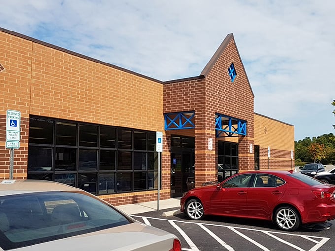 Modern Goodwill architecture meets timeless thrift shopping magic - your next favorite find awaits behind those glass doors.