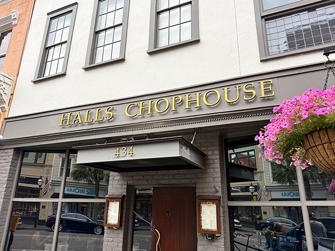 That golden glow isn't just the lighting – it's the promise of perfectly aged beef waiting inside this Charleston institution.
